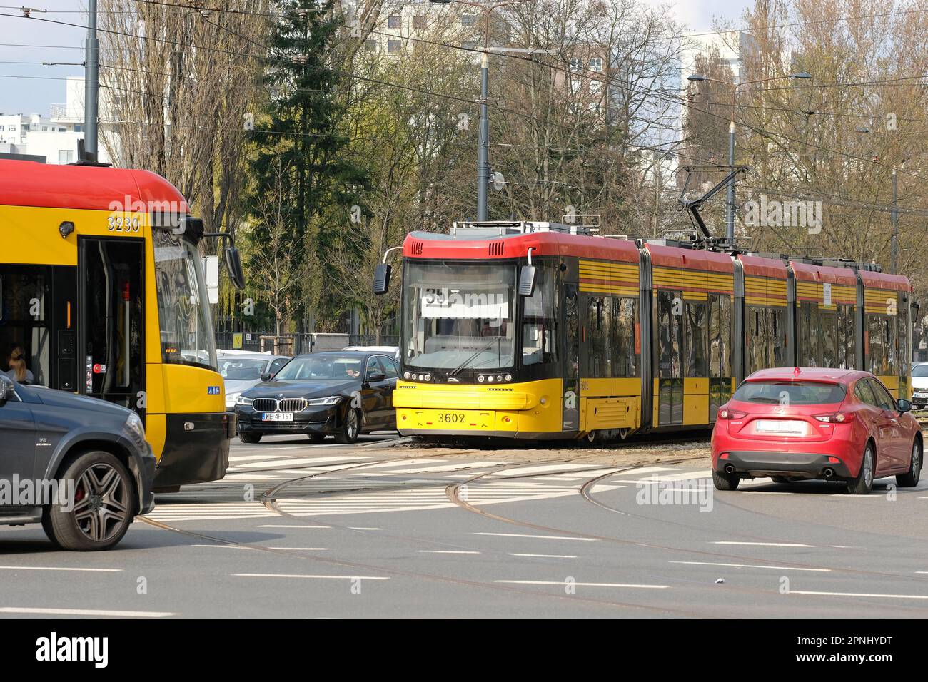 Warsaw Poland public transport trams and car traffic near the city ...