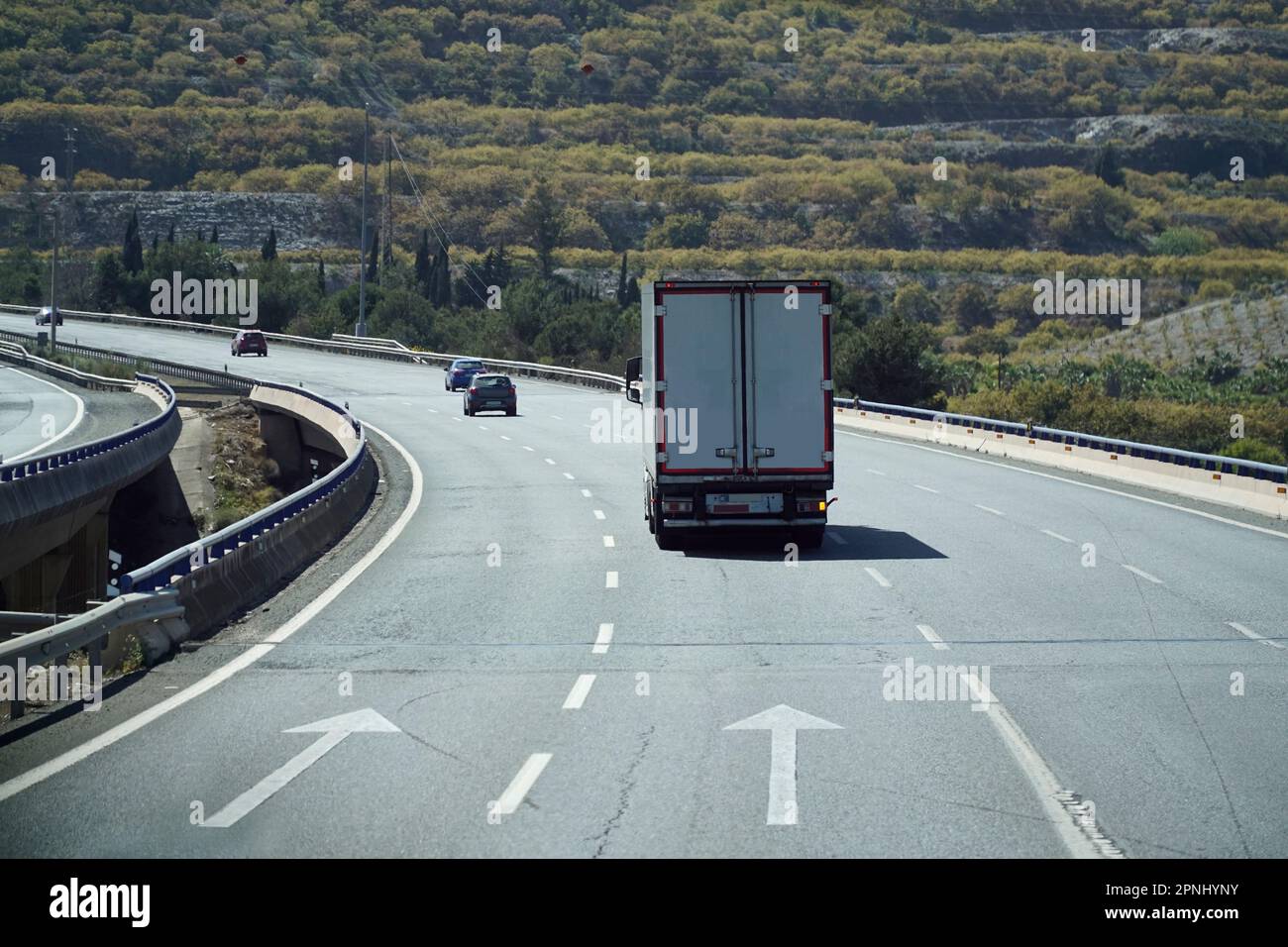 Truck on a highway - back view Stock Photo - Alamy
