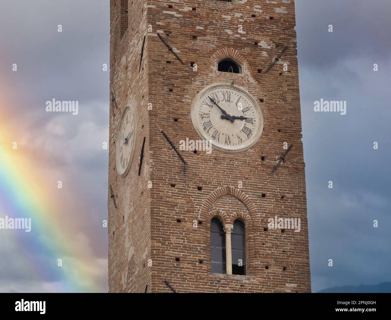 rainbow on clock tower of Old noli medieval village liguria italy Stock ...
