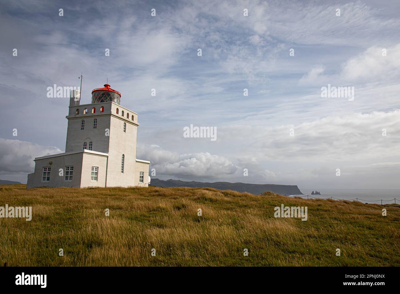 Scenic and spectacular lighthouse on the top of Dyrholaey cliff, in ...
