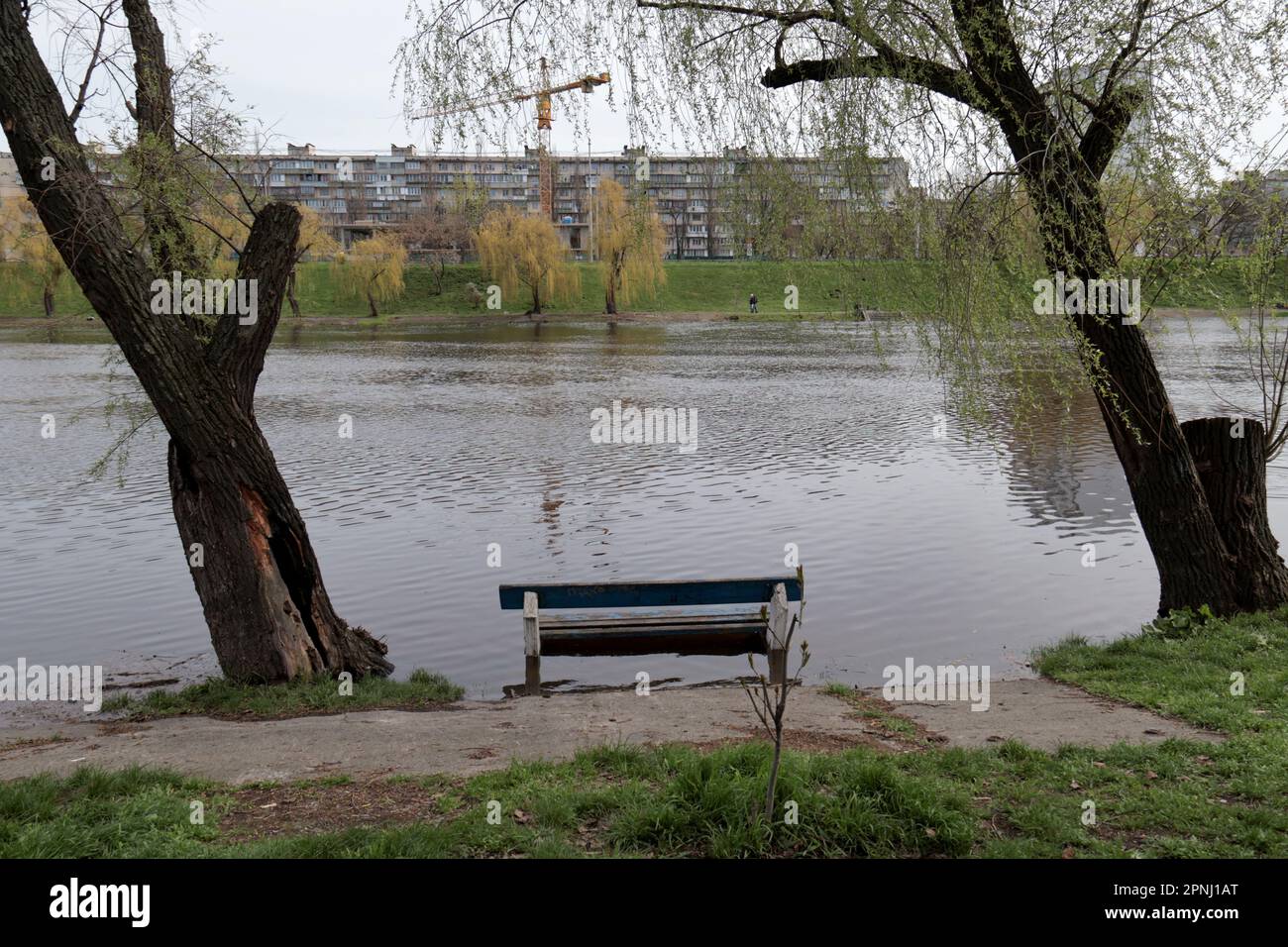KYIV, UKRAINE - APRIL 17, 2023 - A bench is pictured on the embankment ...