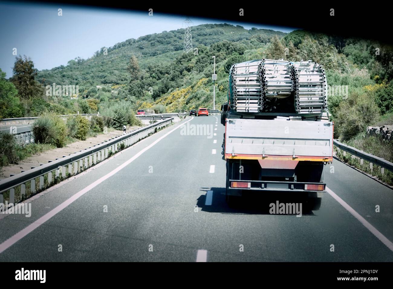 Truck on a road - back view Stock Photo - Alamy