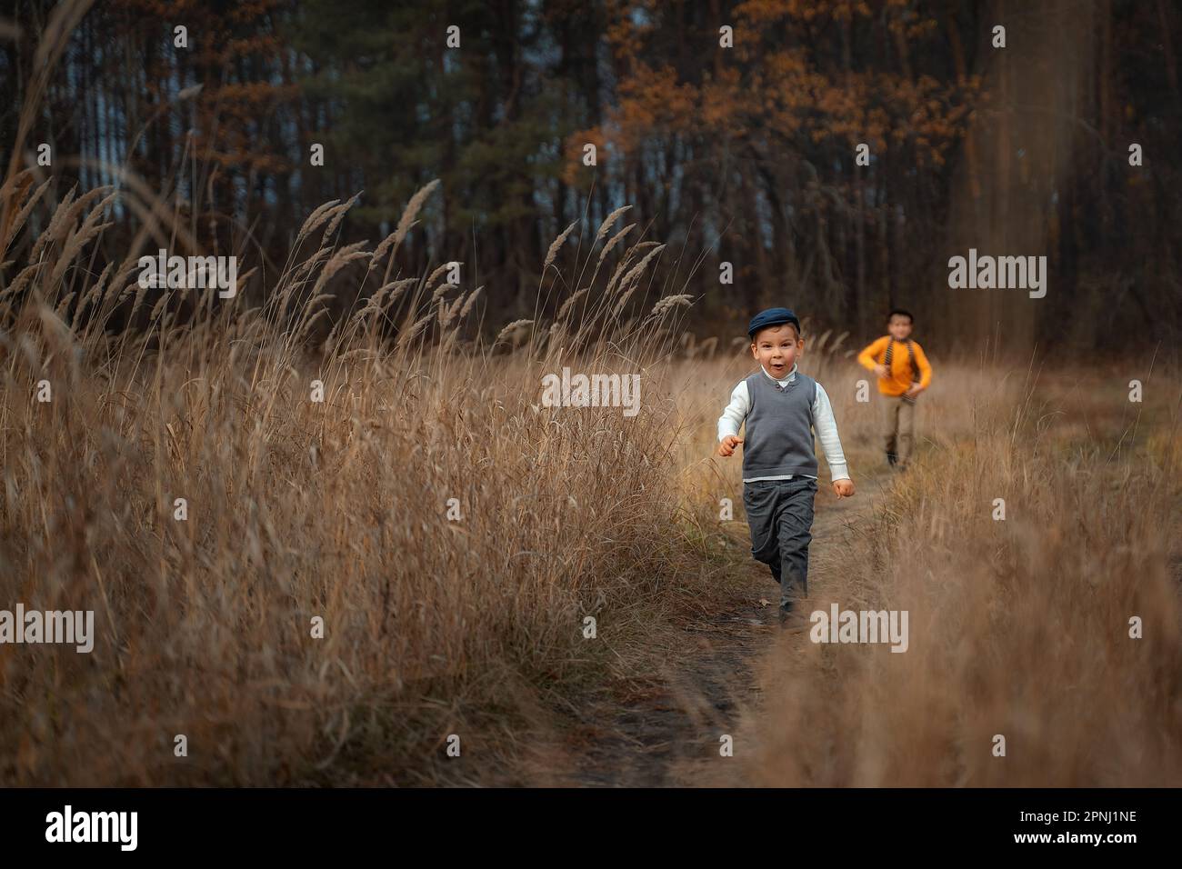 Emotional portrait of positive and happy little boy running away with ...