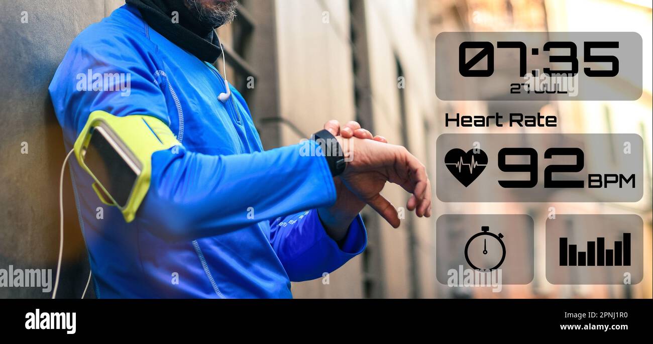 Man running in the park. Healthy runner with smart fit watch ...