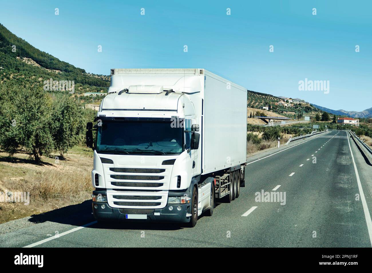 Truck on a highway - front view Stock Photo - Alamy