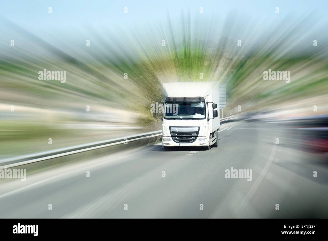 Truck on a highway - front view, zoom effect Stock Photo - Alamy