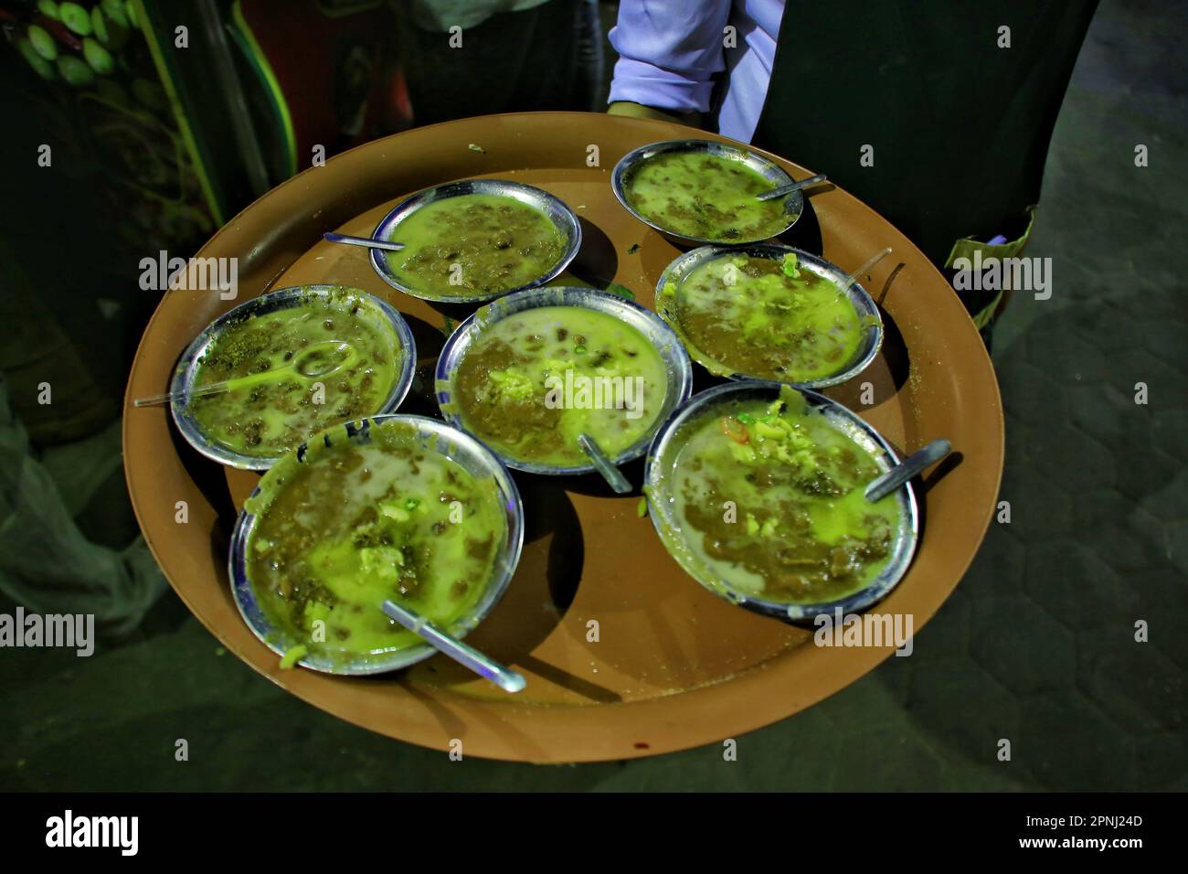 People sit in a street restaurant to eat the traditional Egyptian food ...