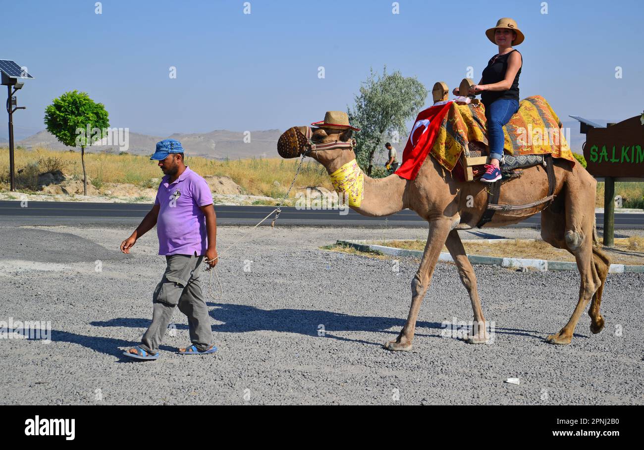 People riding camels in Turkey Stock Photo - Alamy