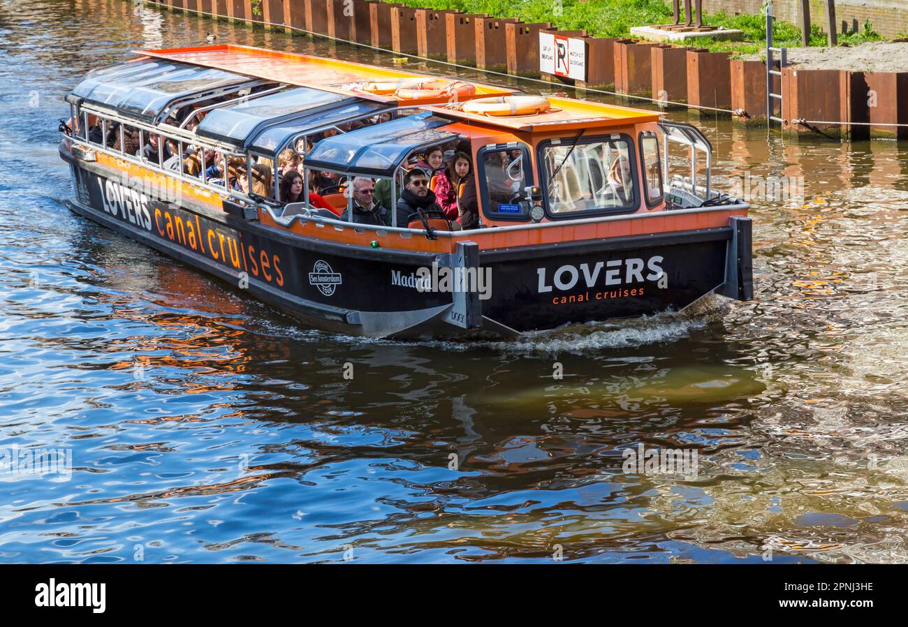 Lovers Canal Cruises Official See Amsterdam Tour boat travelling along canal at Amsterdam ...