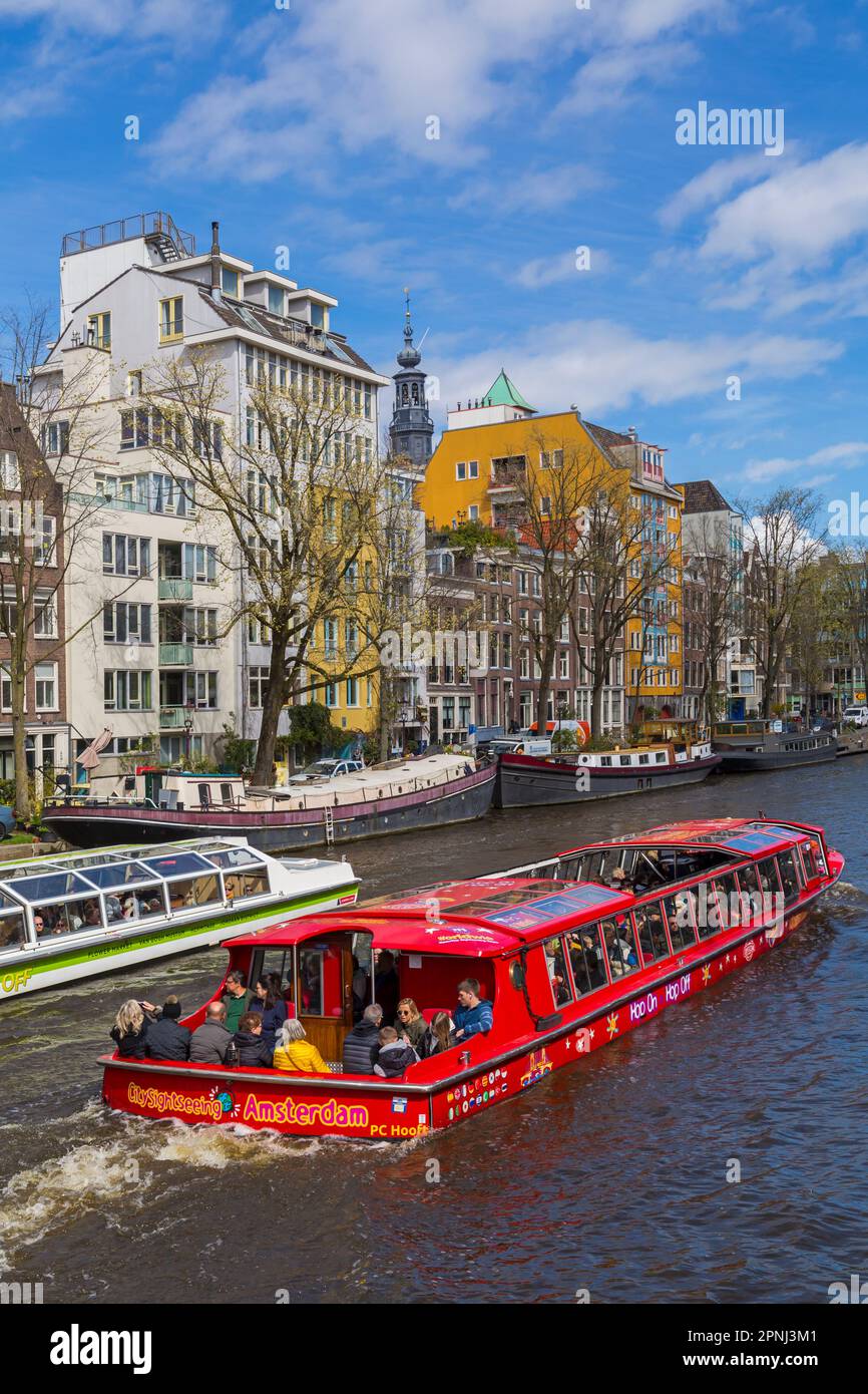 Tourists on City Sightseeing Amsterdam hop on hop off tour boat ...