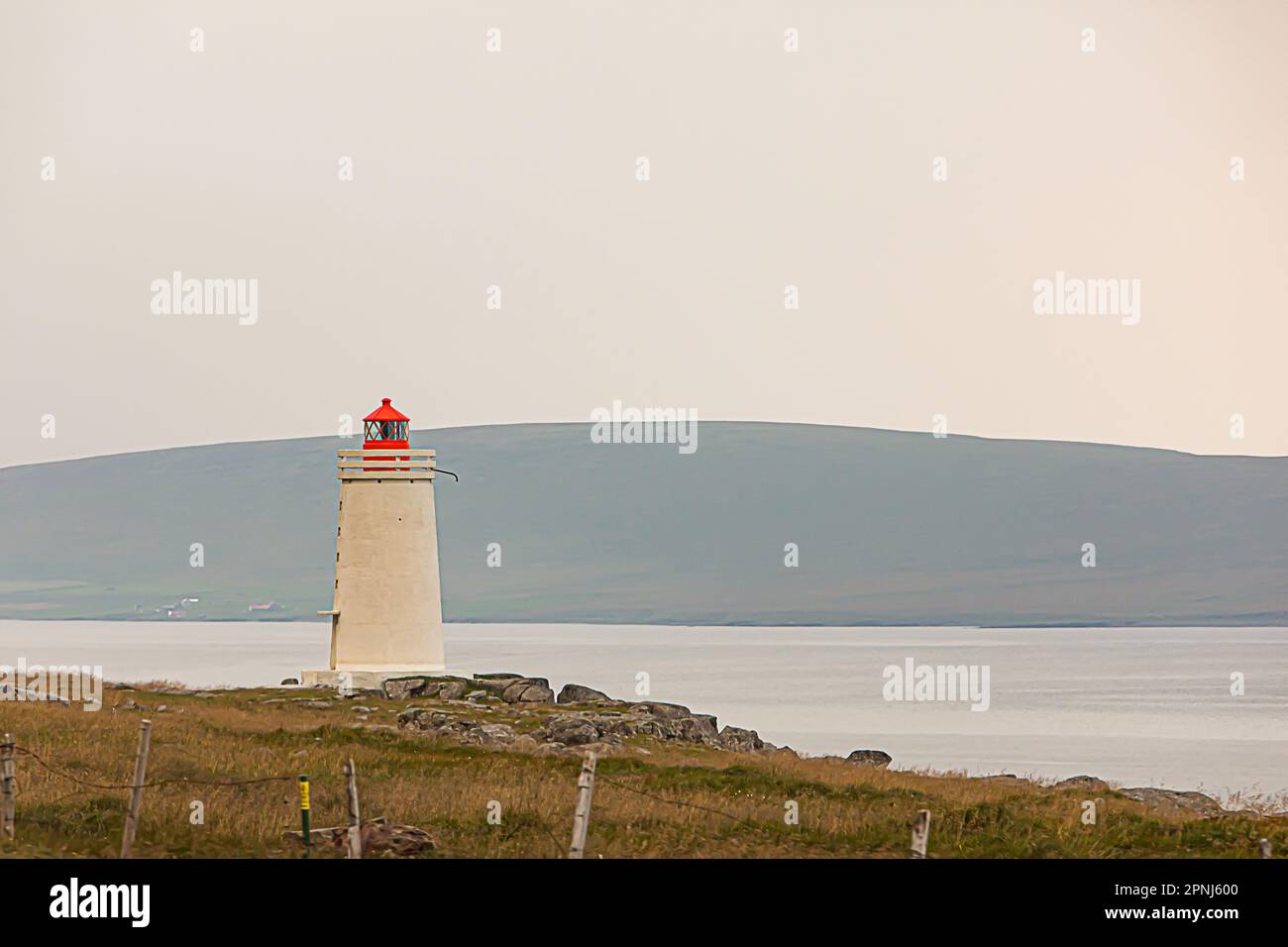 Sunset view of a beautiful lighthouse in the icelandic countryside in ...