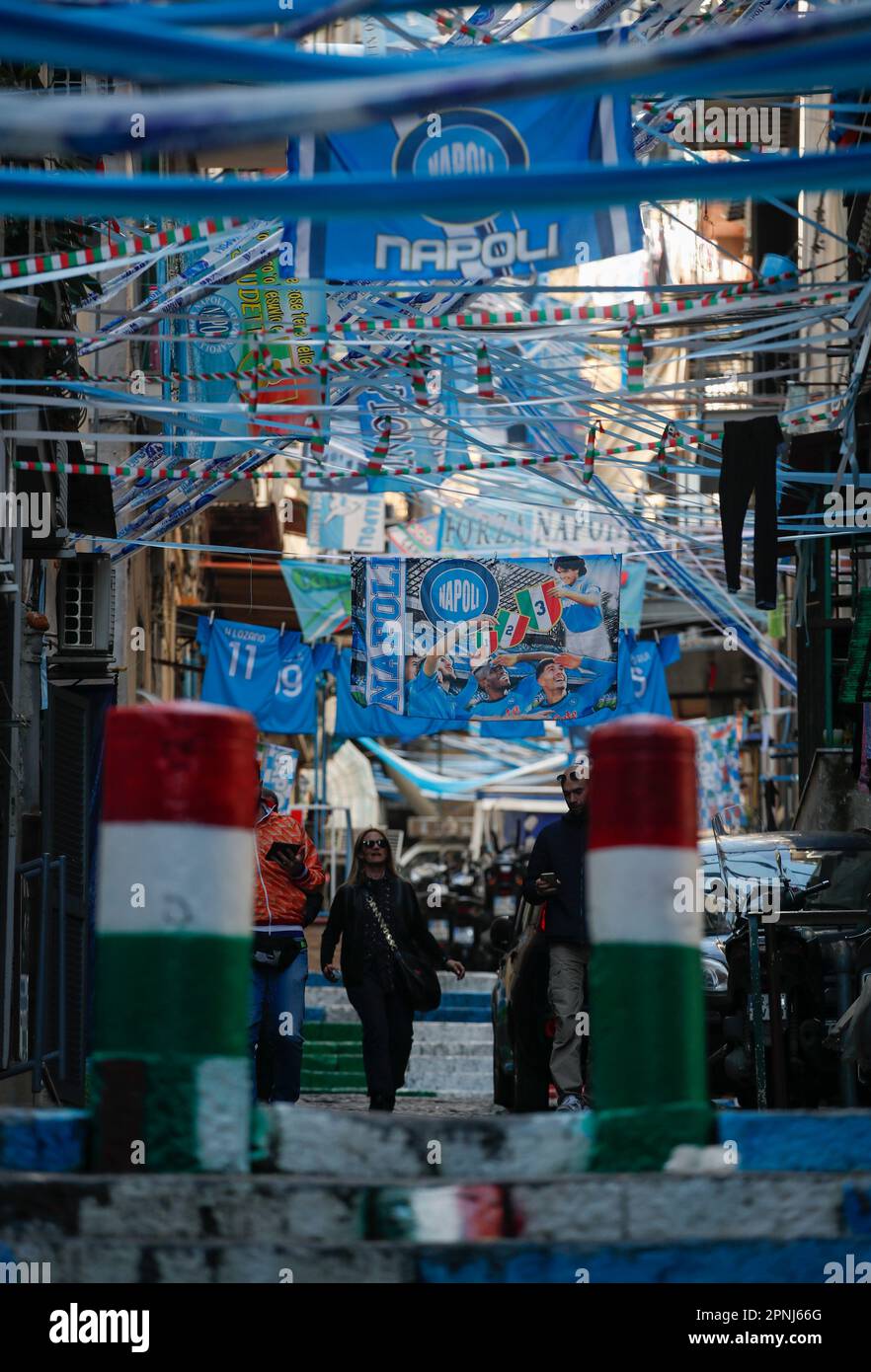 Naples, Italy. 19th Apr, 2023. A woman passes under ribbons with the ...