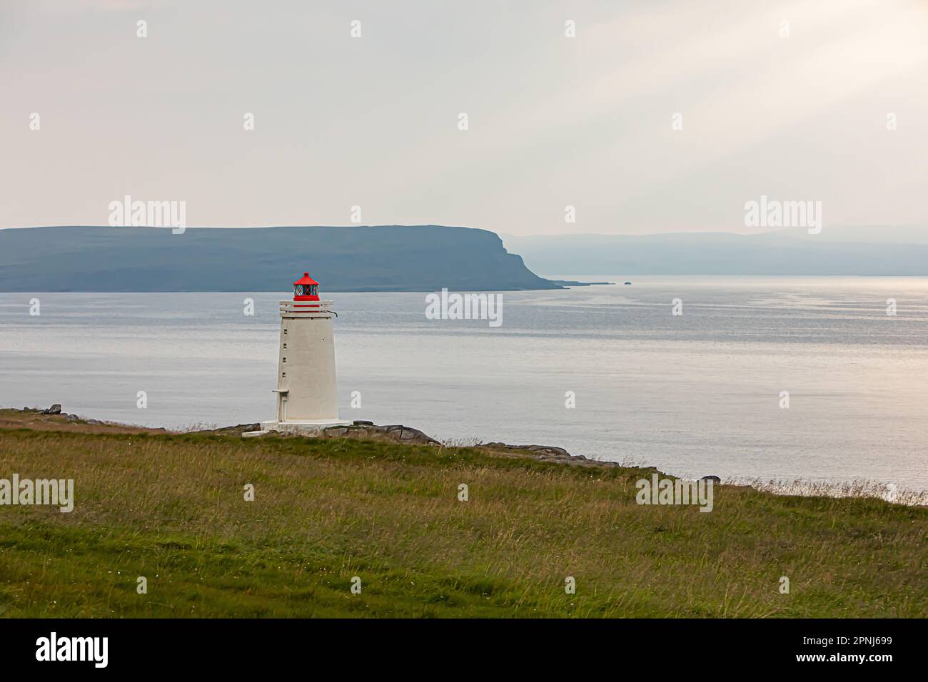 Sunset view of a beautiful lighthouse in the icelandic countryside in ...