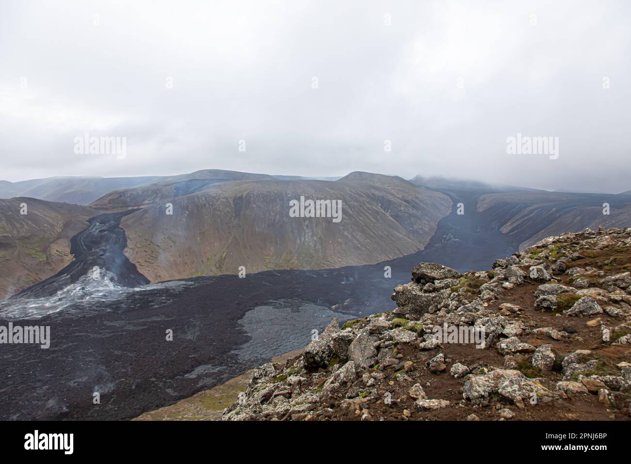 Aerial view of lava strip of Fagradalsfjall volcano in a foggy day ...