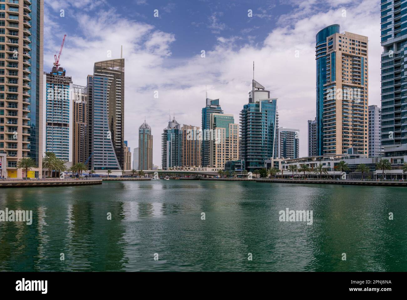 Panorama of apartment blocks surround the water at Dubai Marina in the ...