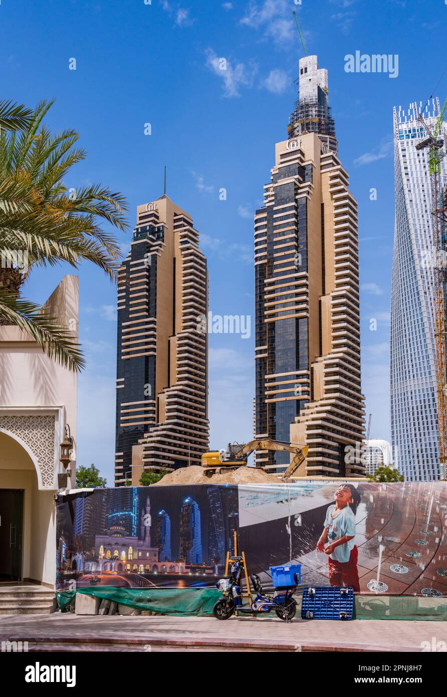 Dubai, UAE - April 2, 2023: New apartment blocks under construction by ...