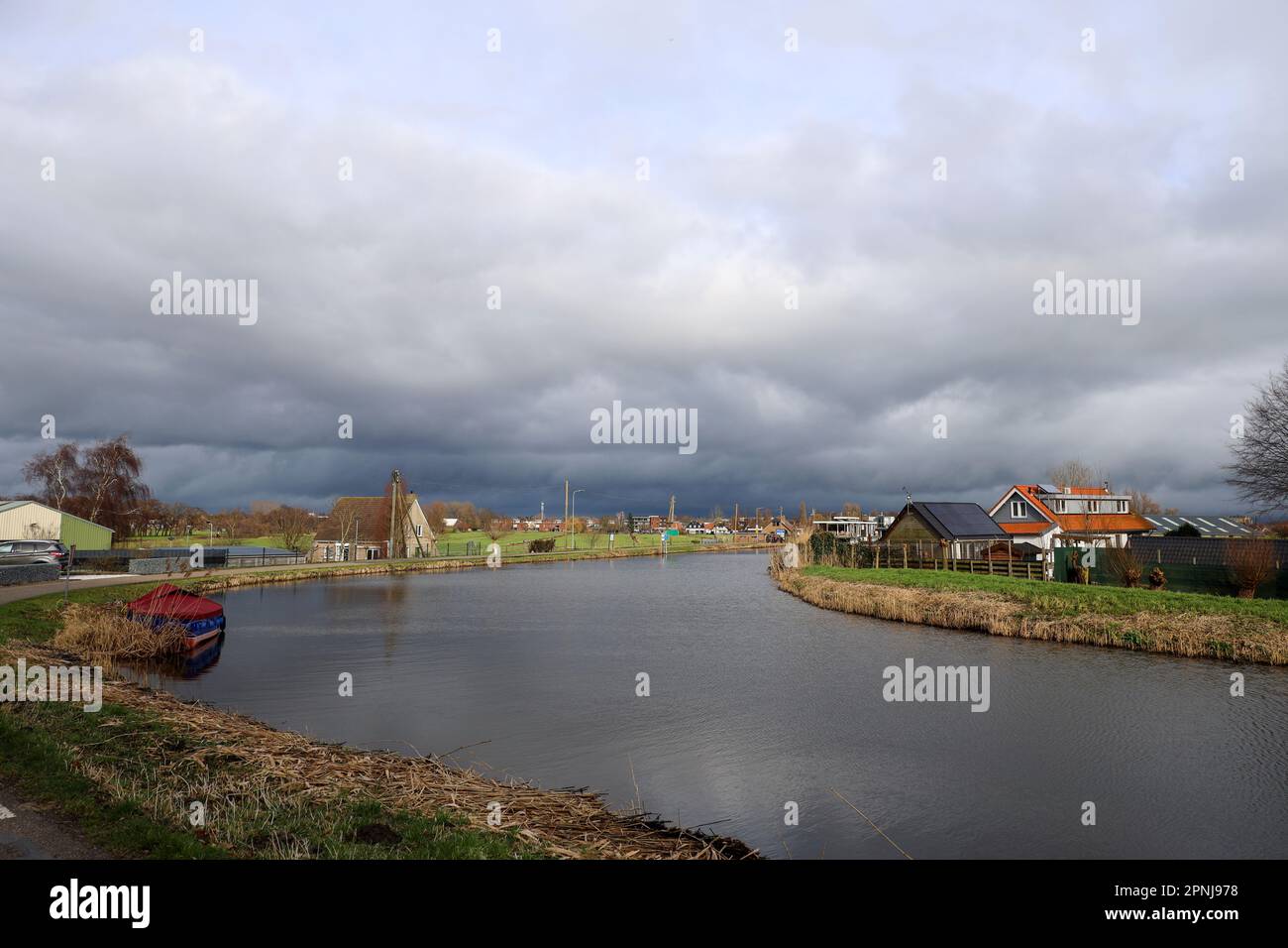 Ring Canal of the Zuidplaspolder with dark clouds above it in ...