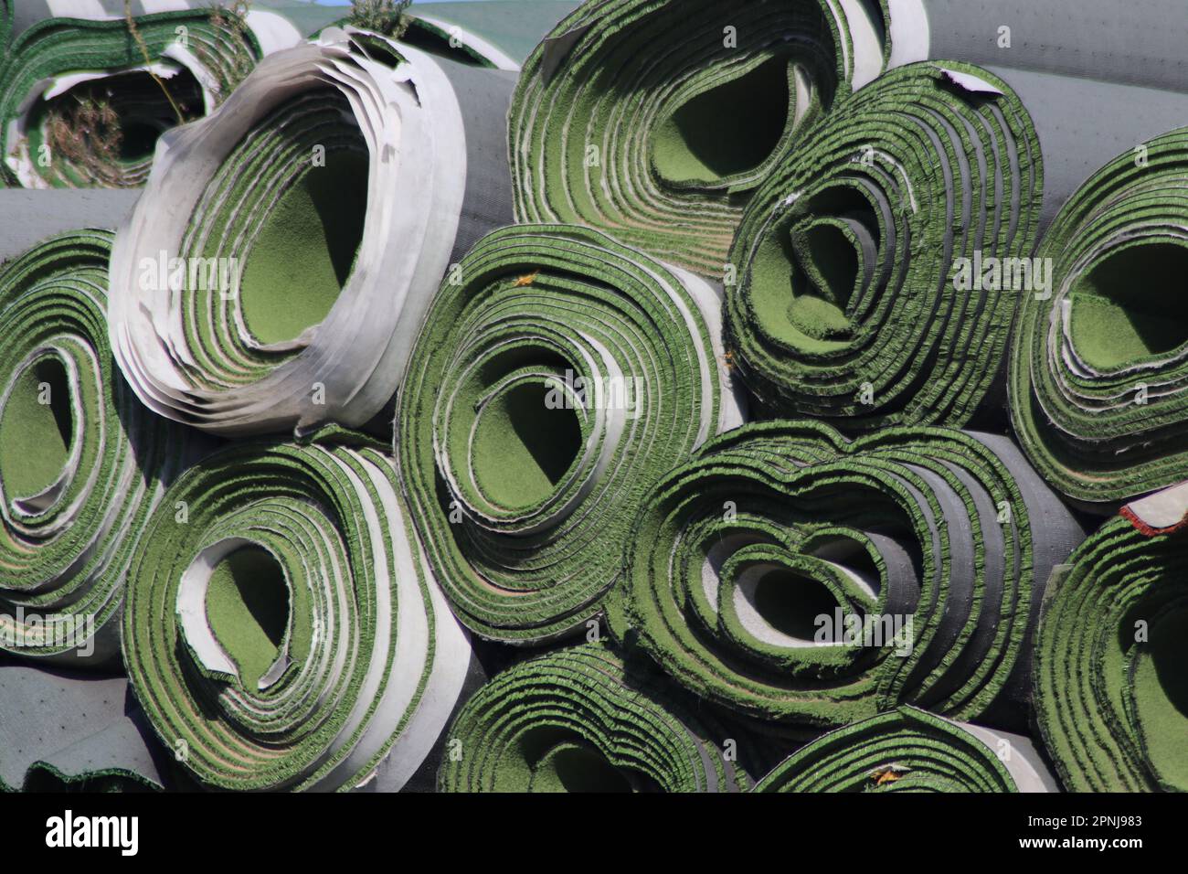 Rolls with artificial grass at waste collector in the port of amsterdam ...