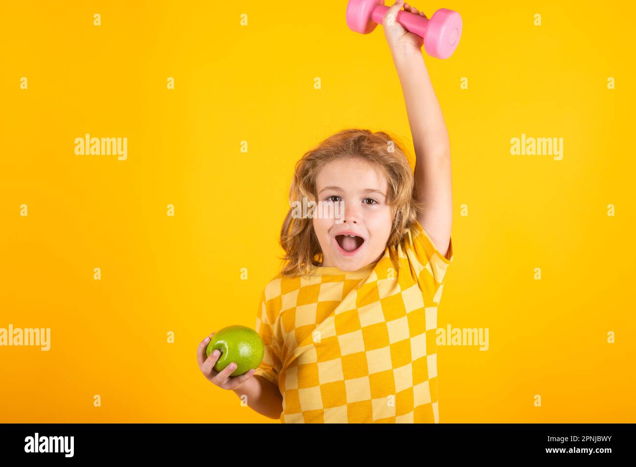 Cute child boy pumping up arm muscles with dumbbell. Fitness kids with dumbbells Stock Photo - Alamy