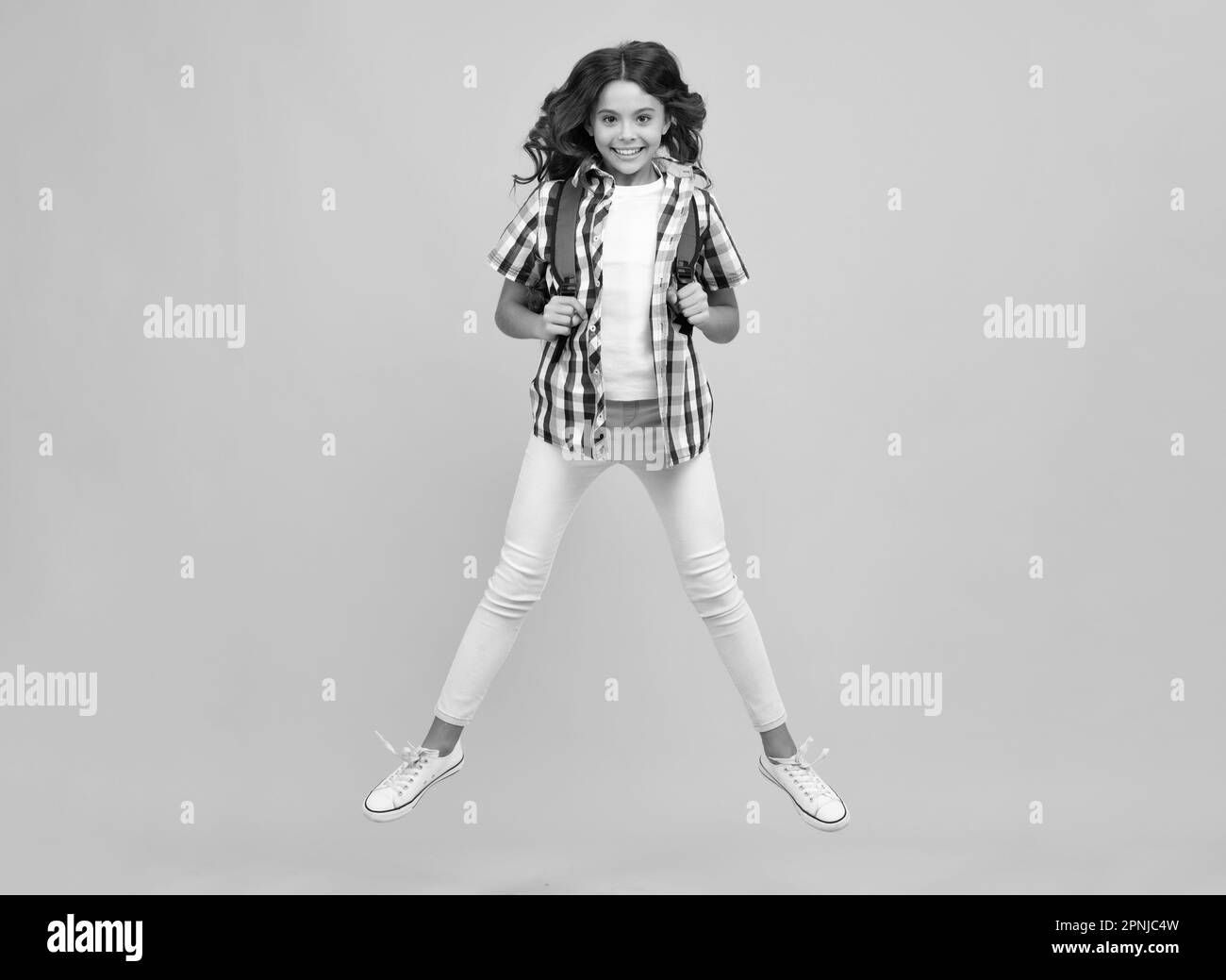 Back to school. Teenage school girl ready to learn. Crazy run and jump ...