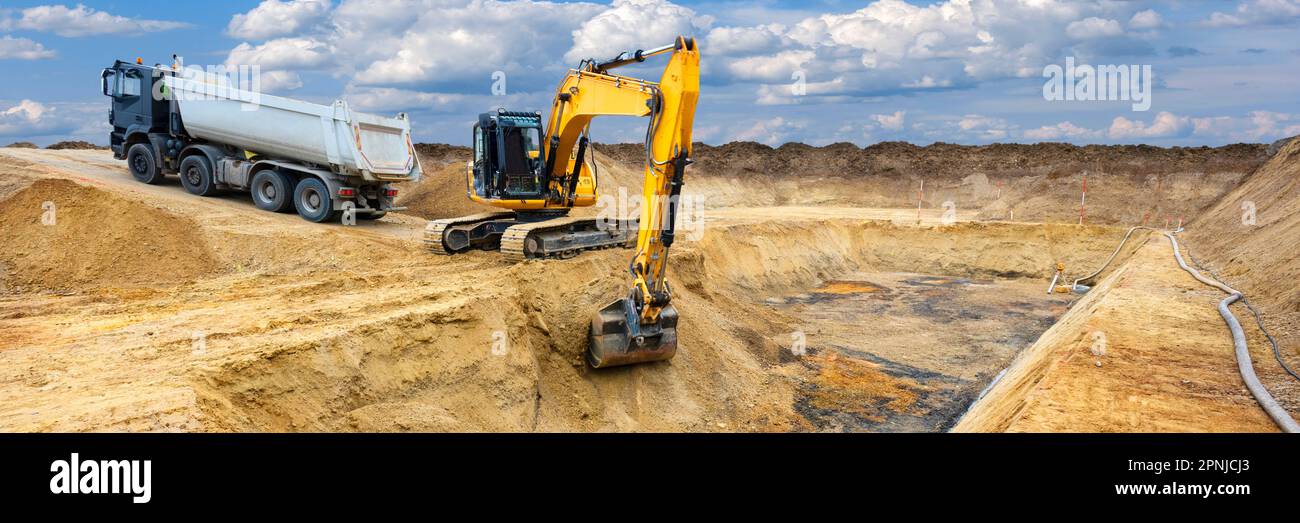 excavator is digging and working at construction site Stock Photo - Alamy