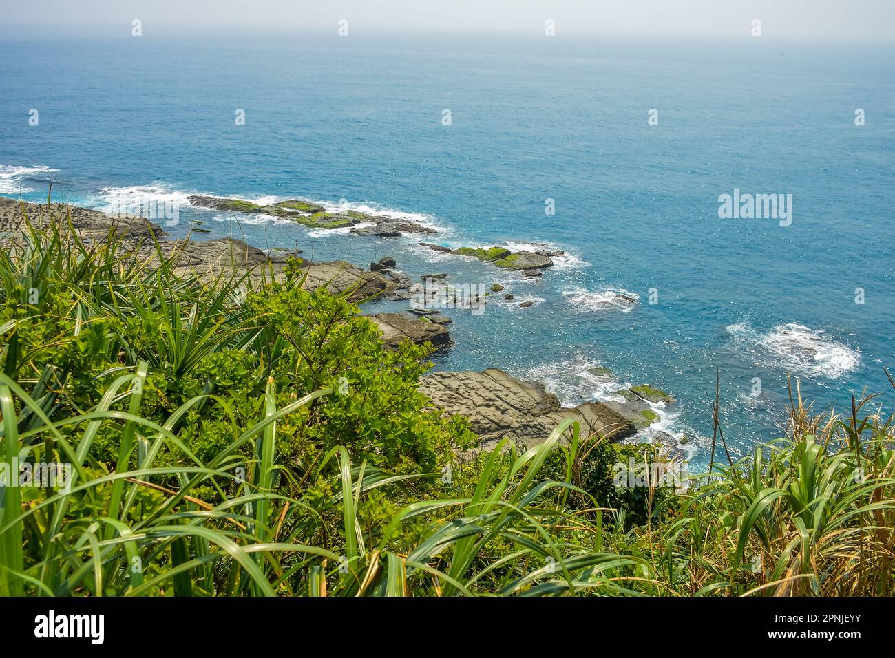 Bitou Cape (Bitoujiao) rocky sea shore beach with blue ocean in a ...