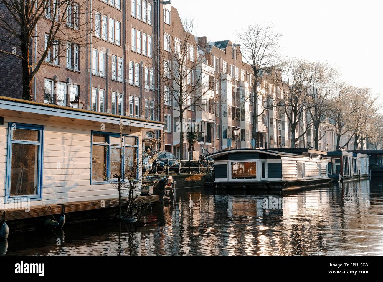Aesthetic canals of Amsterdam at sunset, view from the water ...