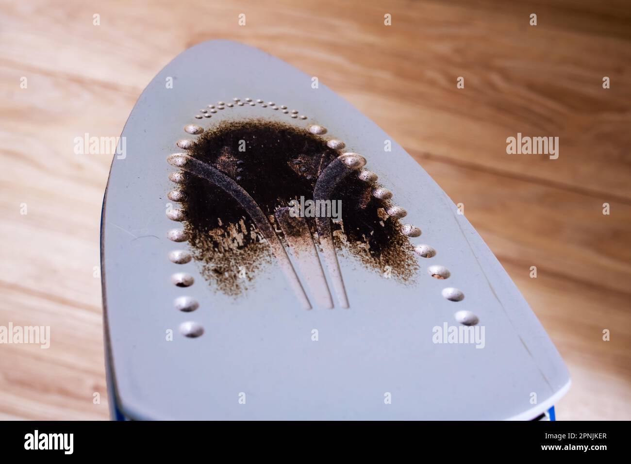 Burnt surface of iron close up at home Stock Photo - Alamy