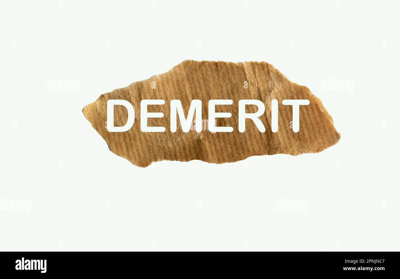 Symbol of deficiency. Concept word Demerit on a piece of paper ...