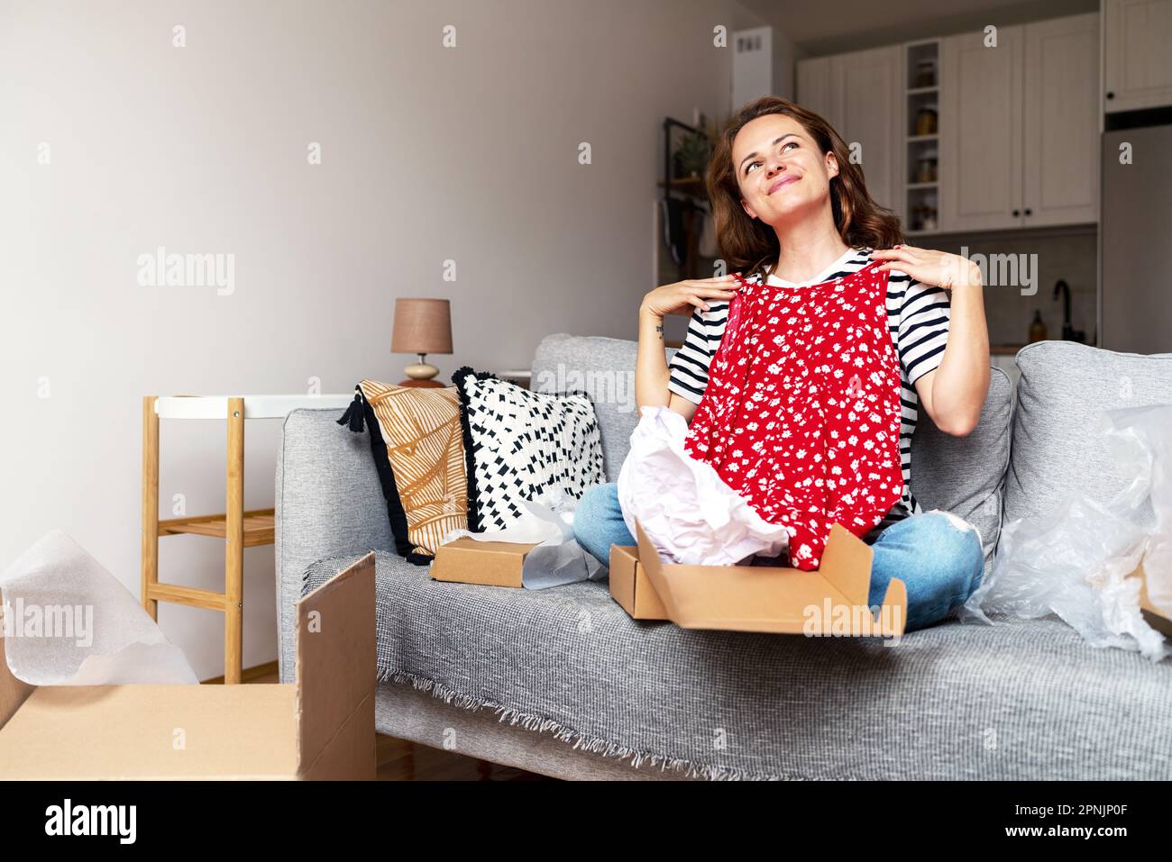 Unpacking parcel clothing hi-res stock photography and images - Alamy