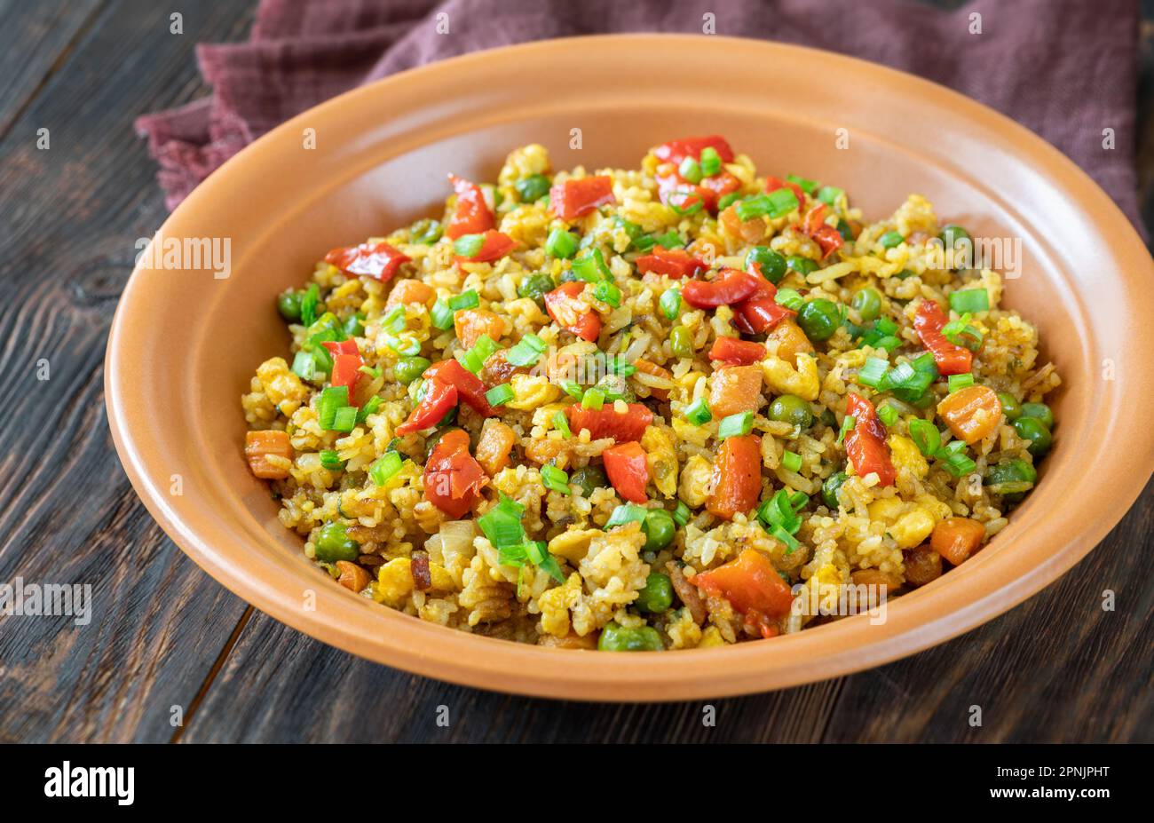 Portion of fried rice with eggs and vegetables Stock Photo - Alamy