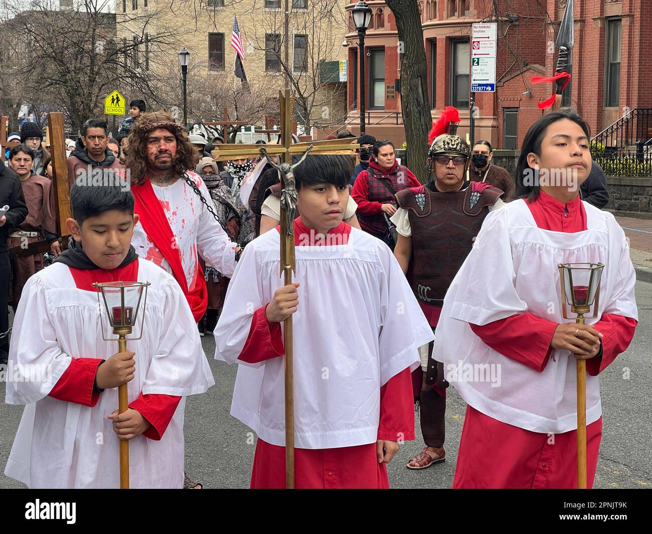 Parishoners of various churches walk the stations of the Cross together ...