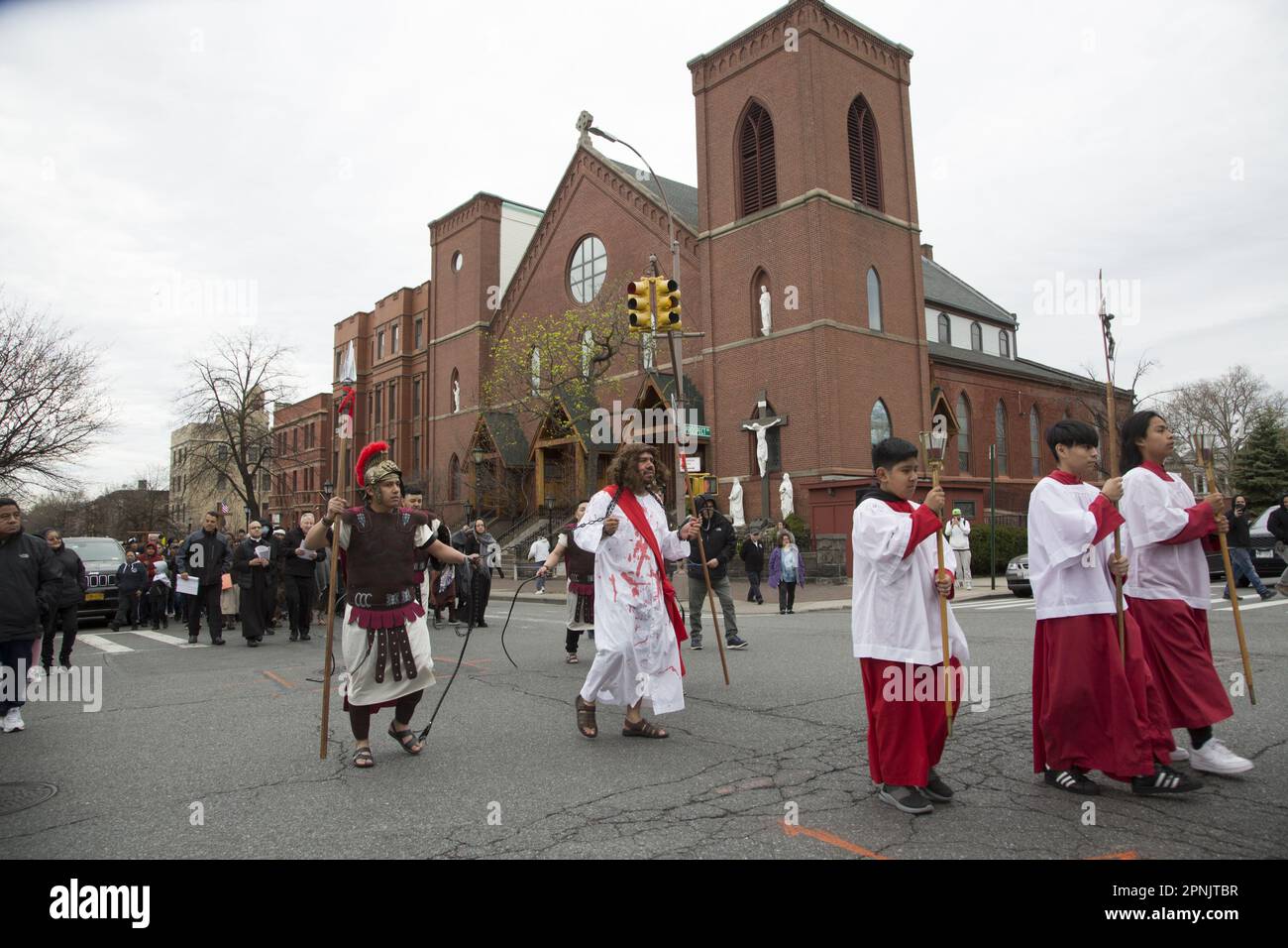 Parishoners of various churches walk the stations of the Cross together ...