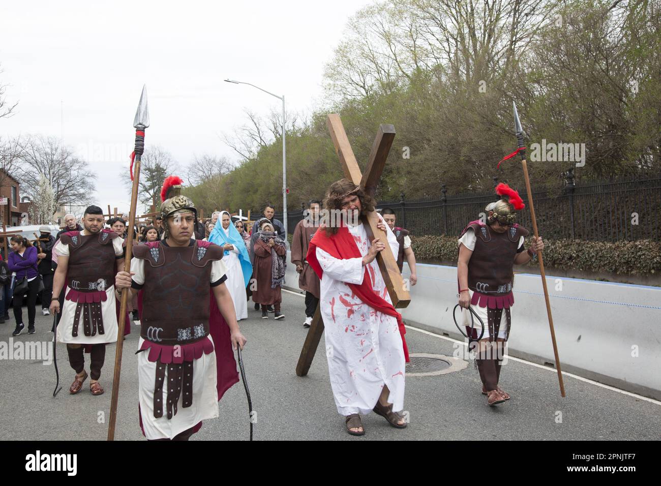 Parishoners of various churches walk the stations of the Cross together ...