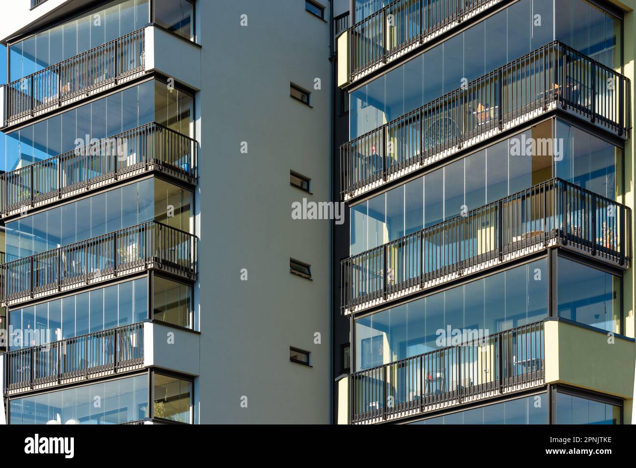 Several balconies on the sunny side of an apartment building Stock ...