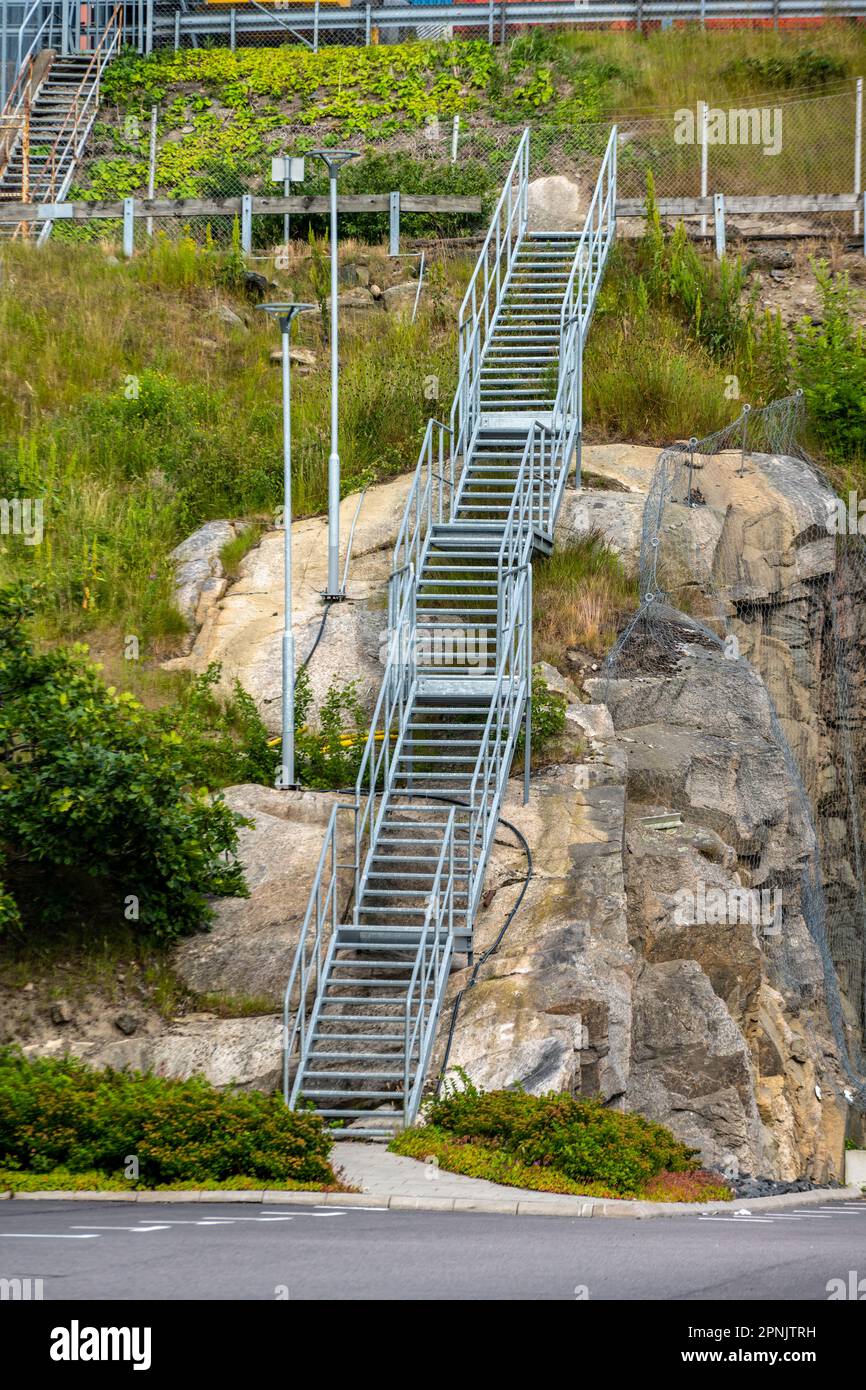 Long metal stairs up a cliff side Stock Photo - Alamy