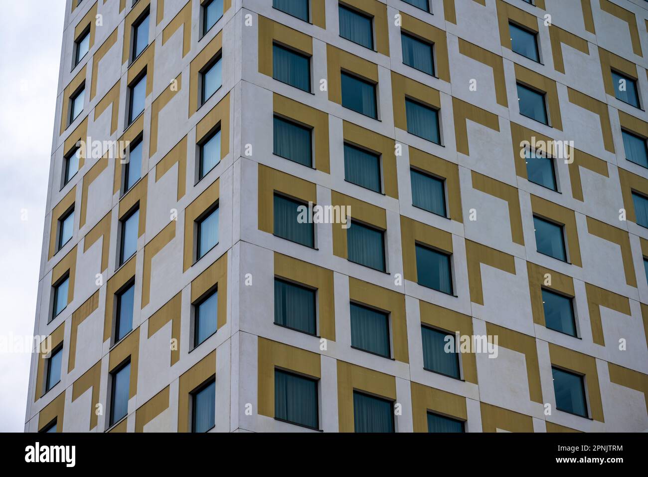 Office high rise with white and green exterior Stock Photo - Alamy