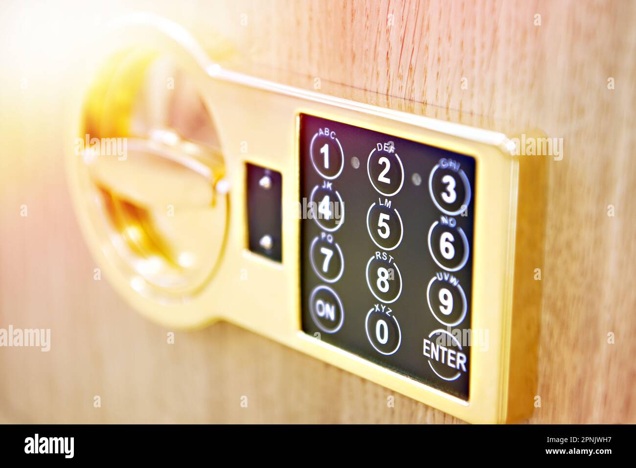 Digital combination safe lock golden Stock Photo - Alamy