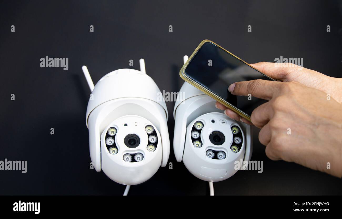 White IP camera, technician setting up camera operation Stock Photo - Alamy