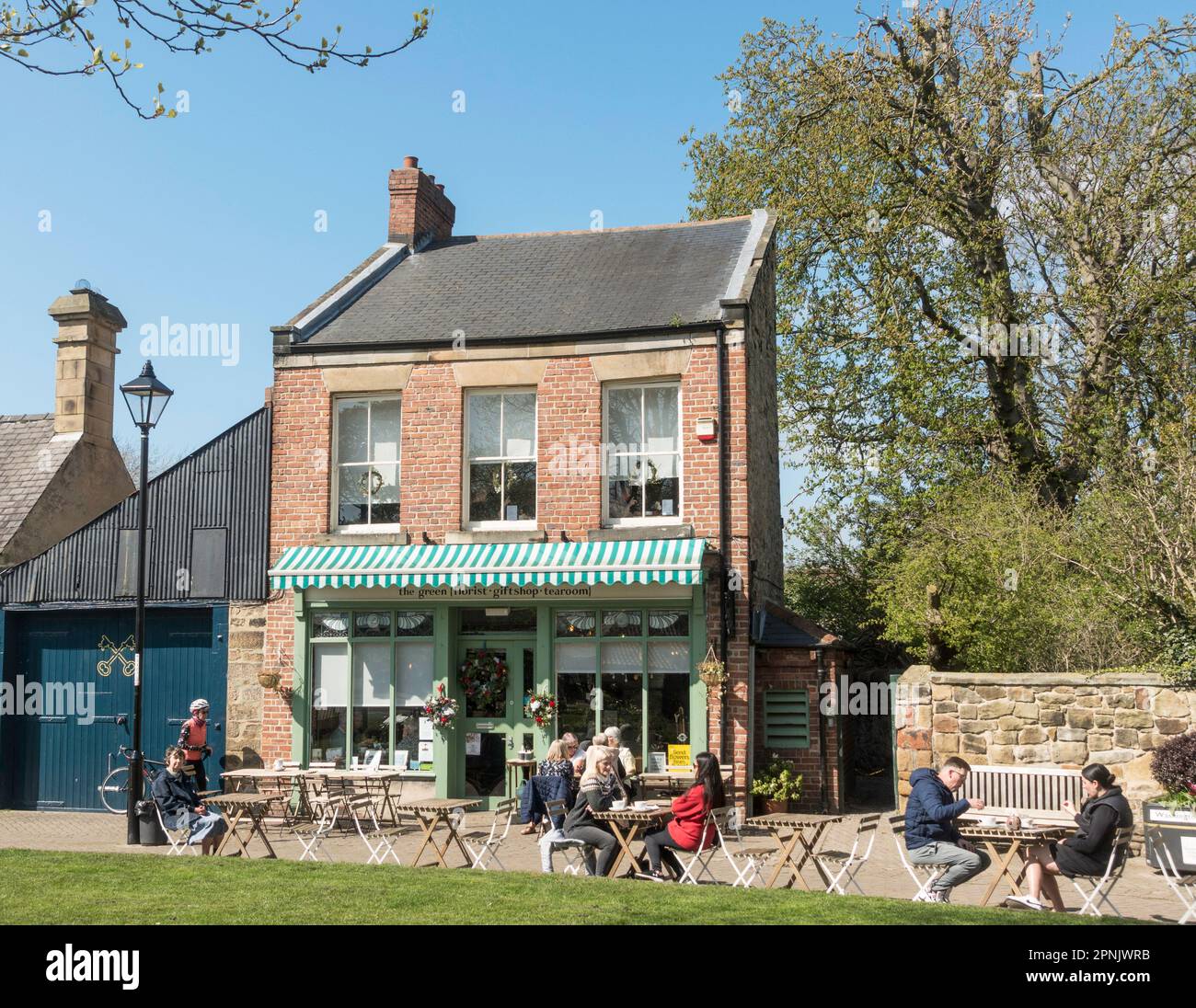 People sitting outside Washington village café, north east England, UK ...