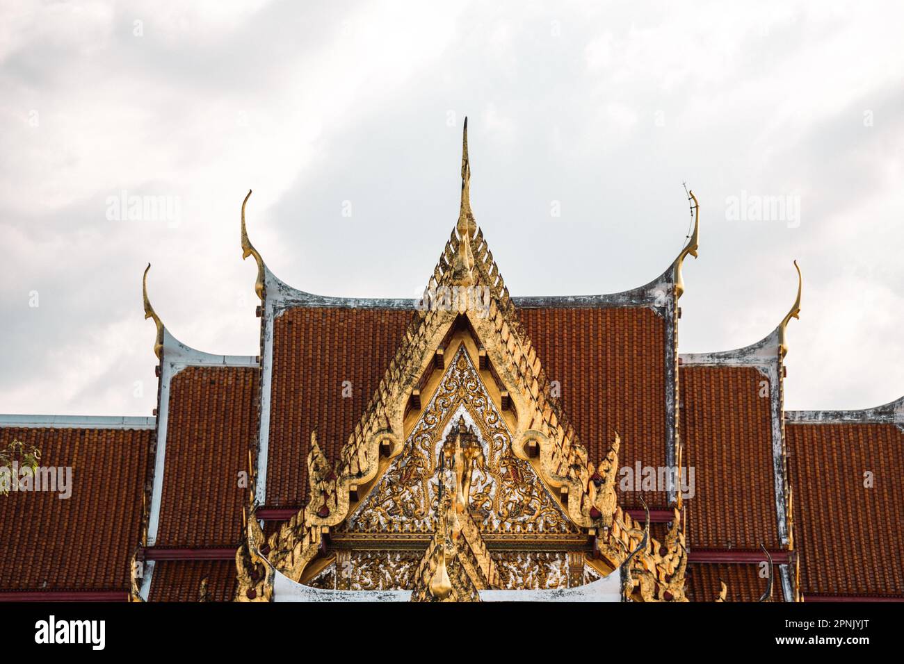 A majestic entrance to a grand building featuring an intricate golden ...
