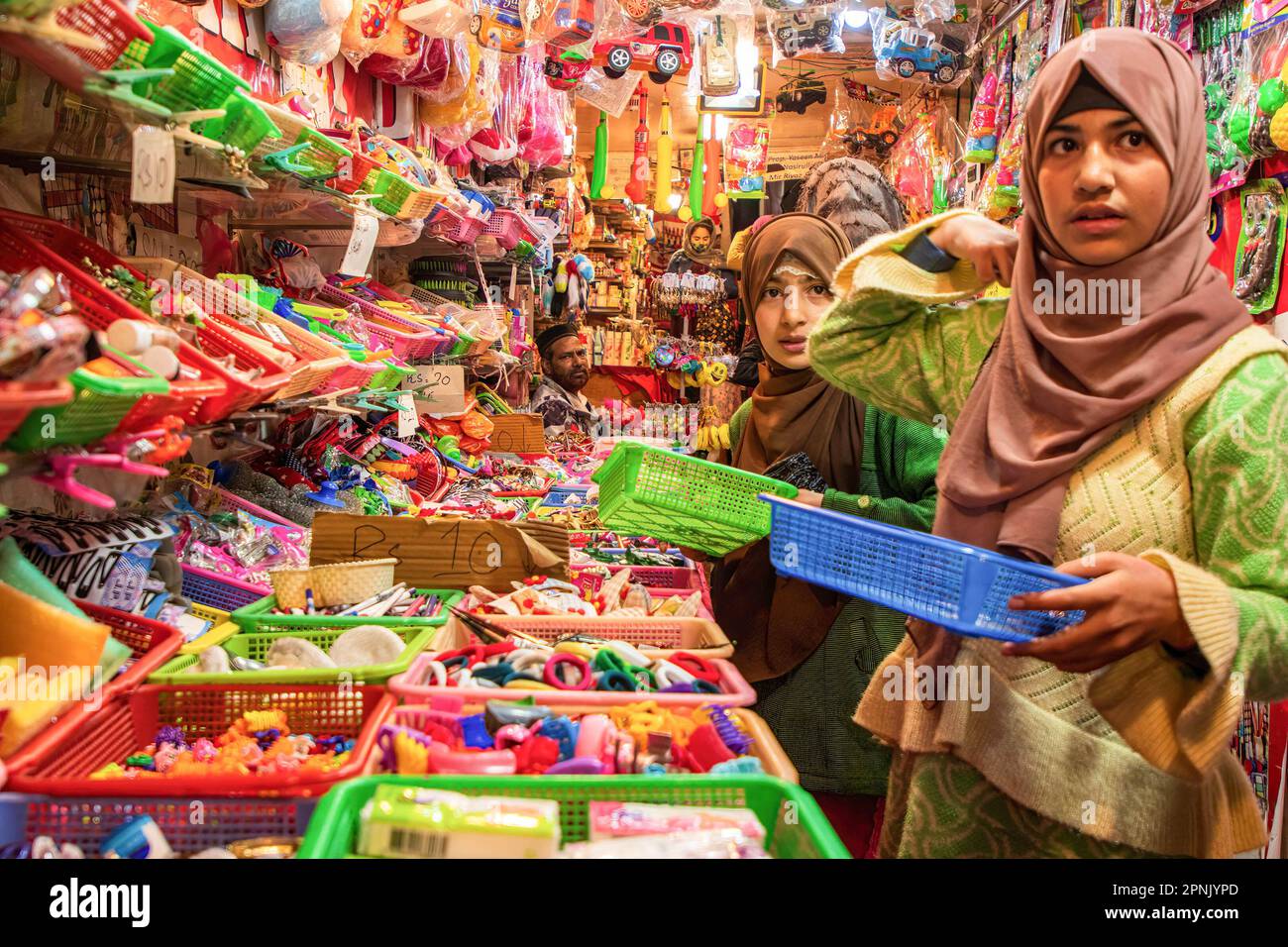 Kashmiri girls seen shopping at a toy shop ahead of the Muslim festival Eid-al-Fitr at a local ...