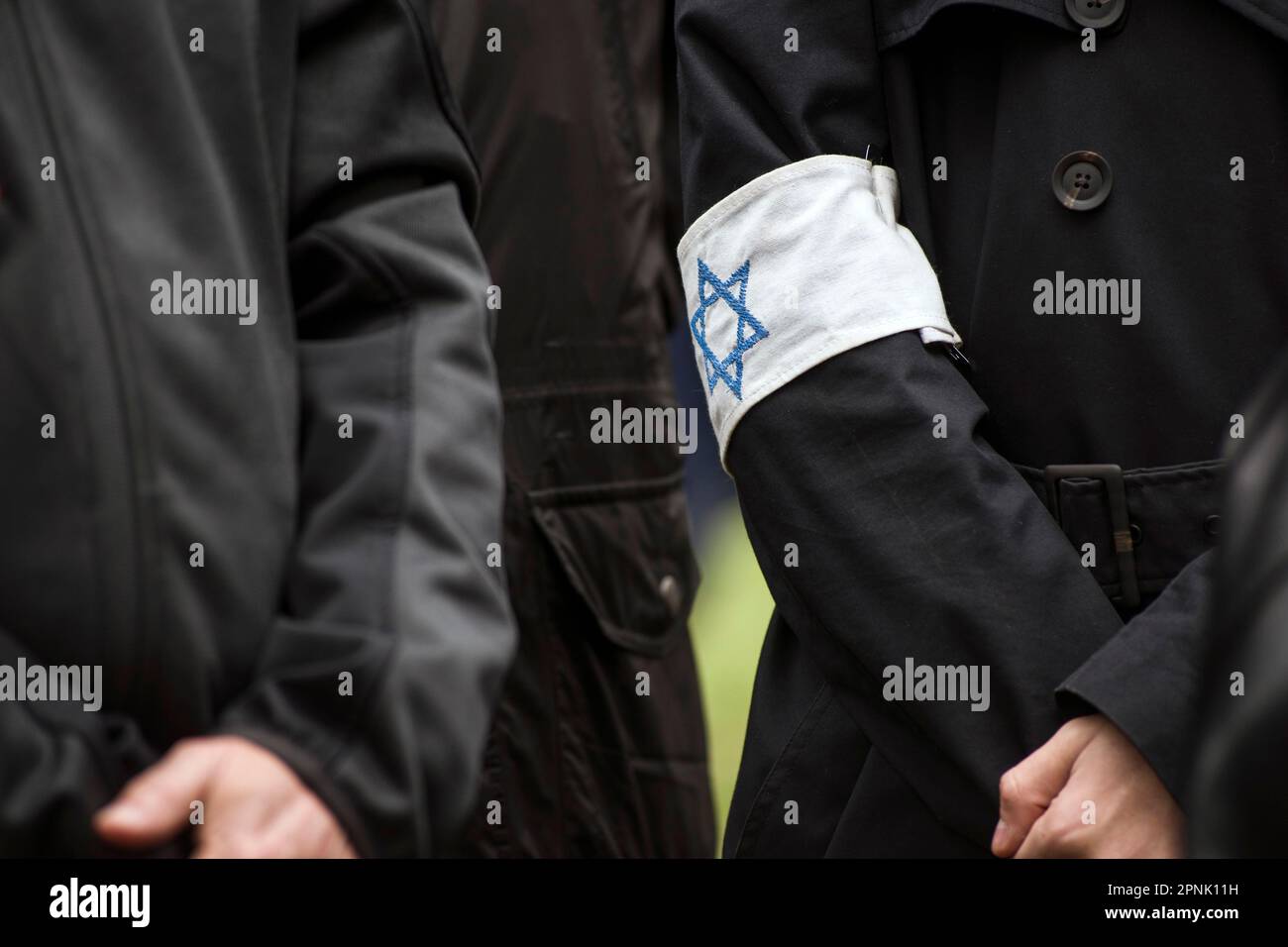 Warsaw, Poland, 19/04/2023, A young man is wearing a David's star badge ...