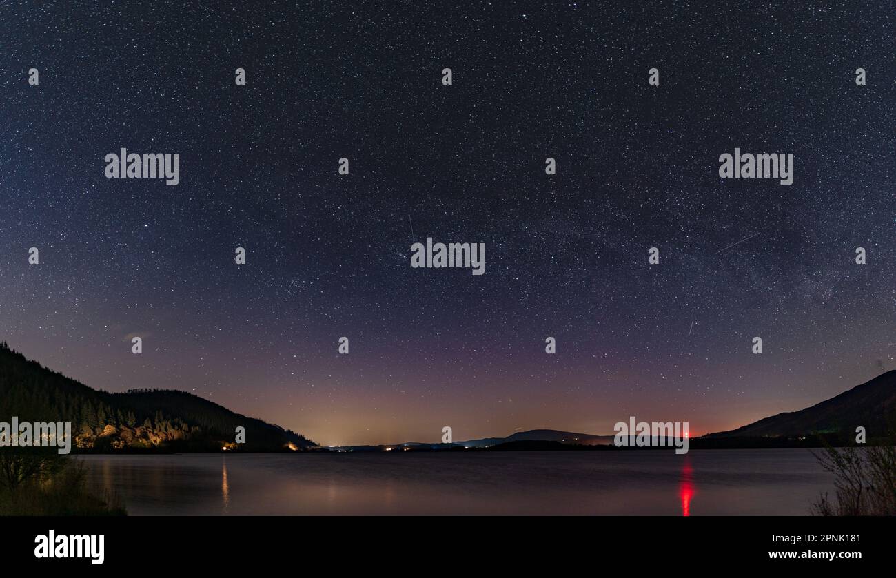 A panoramic night view of the night sky looking over Bassenthwaite lake ...