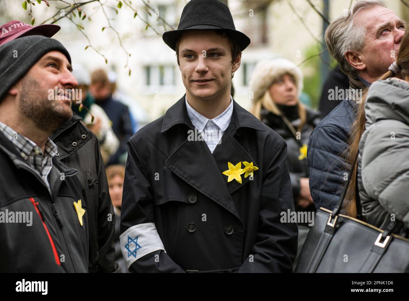 A young man is wearing a David's star badge like the Jews of WWII who ...