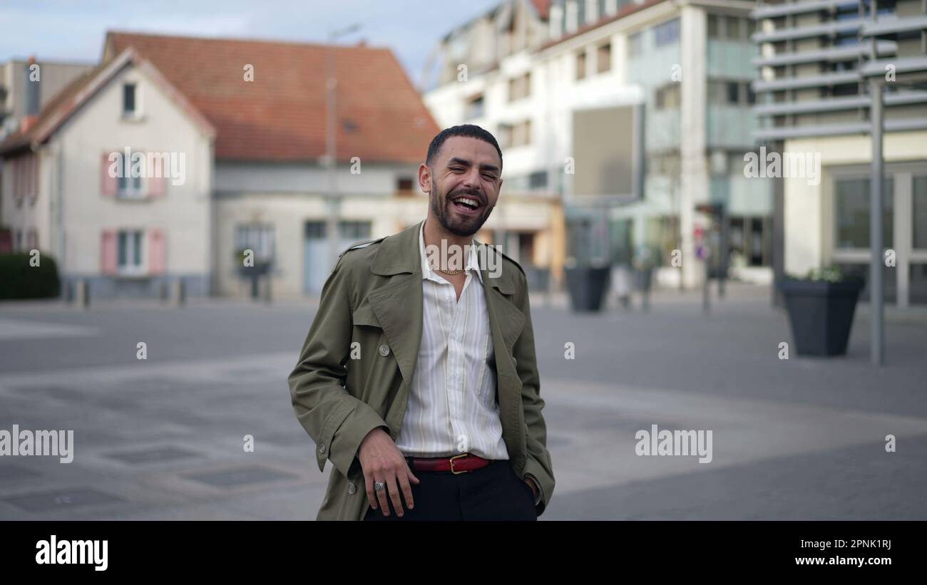 One happy Middle Eastern man smiling and laughing while standing ...