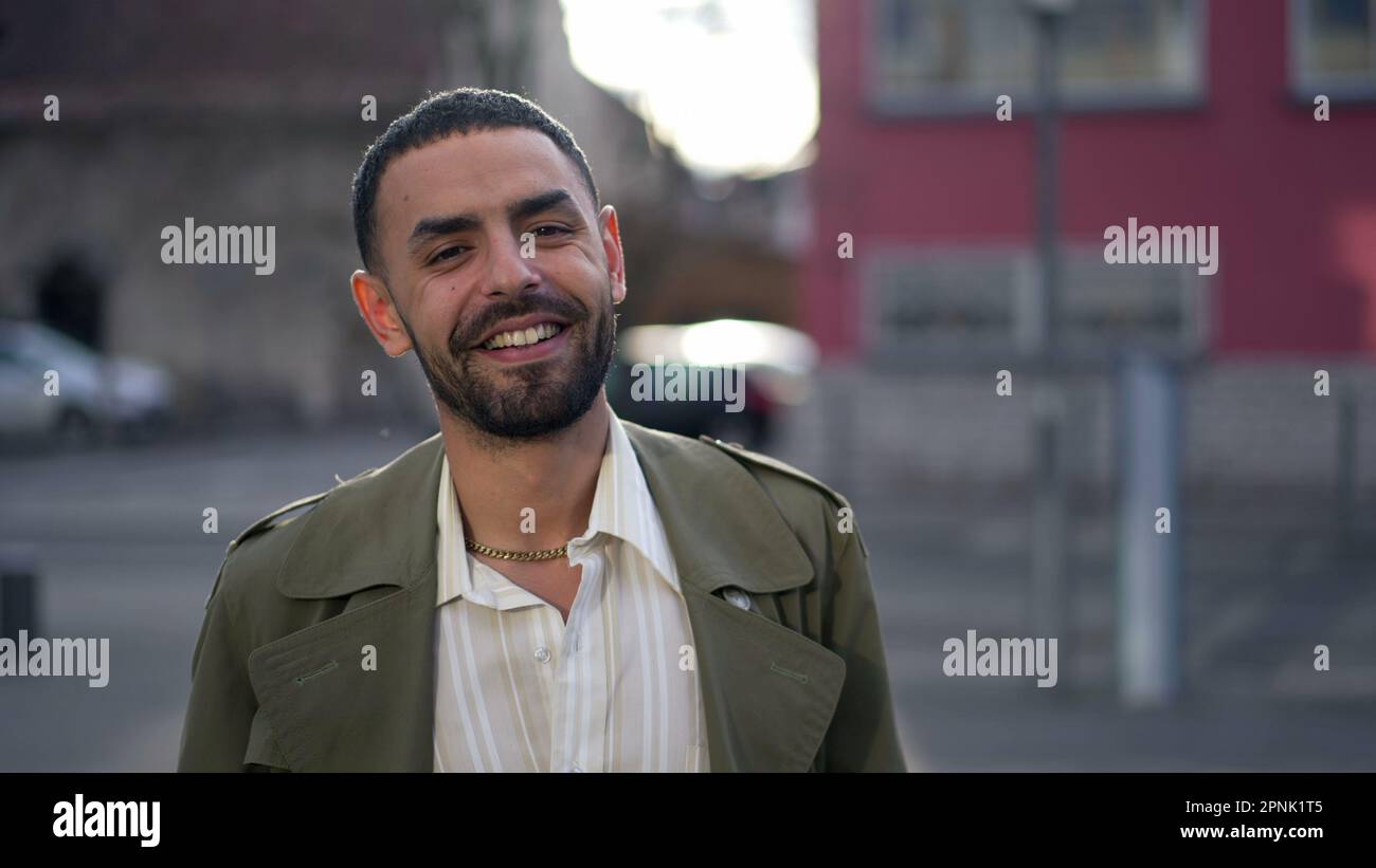 One happy Arab man walking forward toward camera. Tracking shot in ...