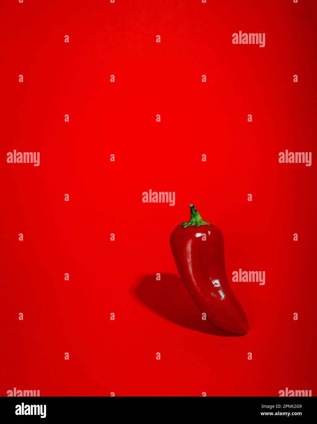 Red Peper on solid background Stock Photo - Alamy