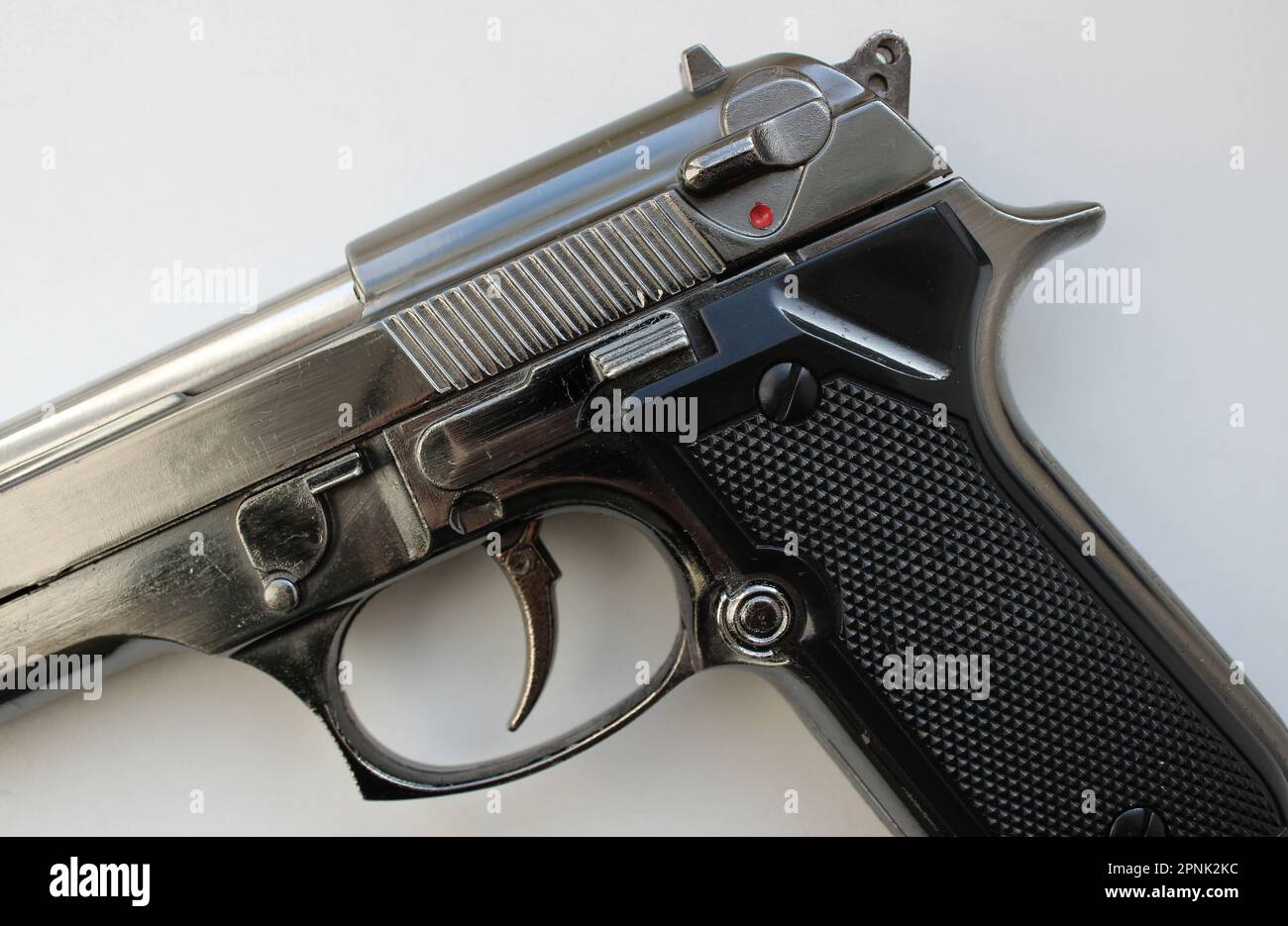 Grip and trigger of automatic pistol caliber 9 mm isolated on a white ...
