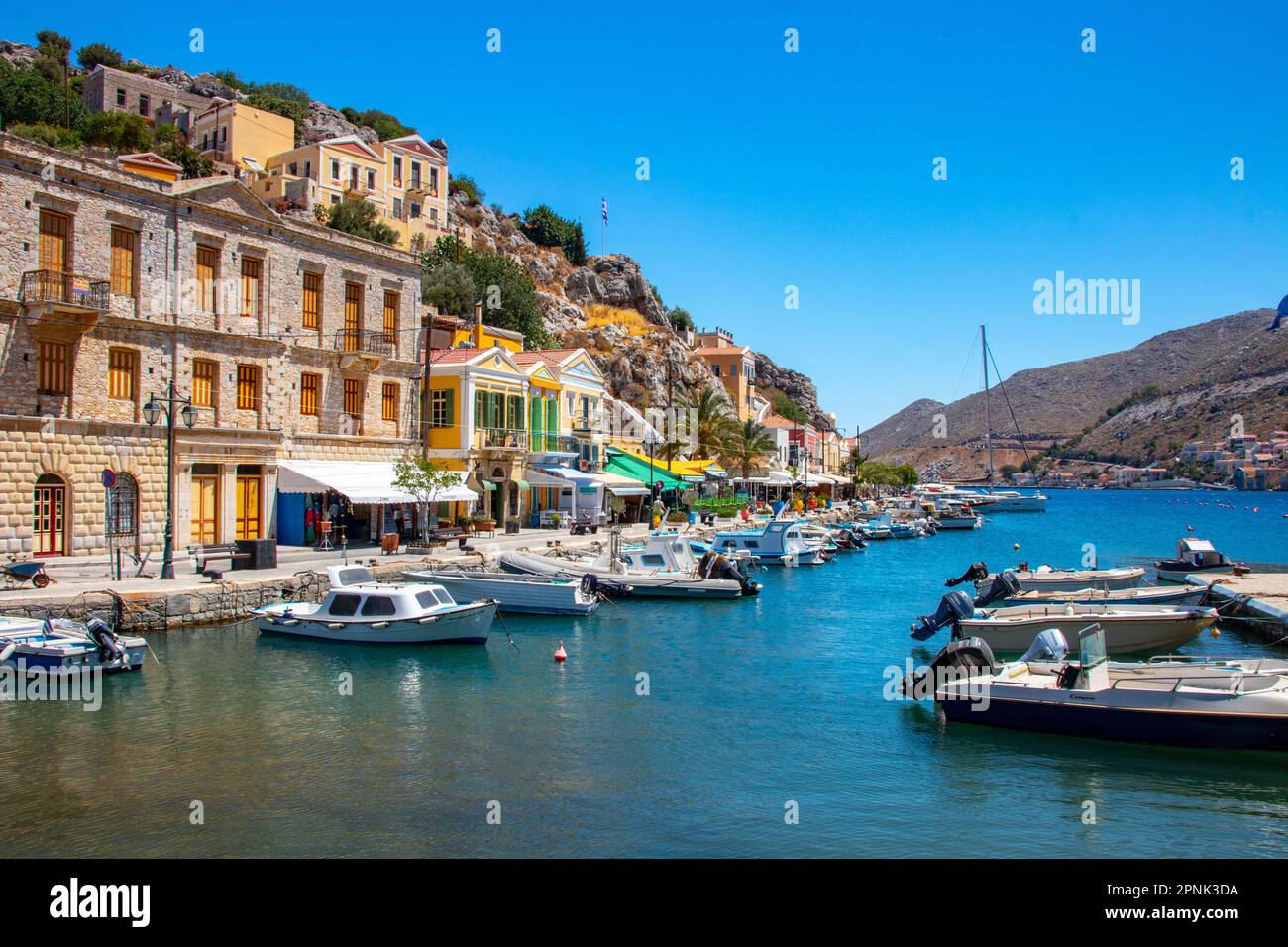 SYMI, Greece - Jun 03, 2021. The harbour of Symi town with the ...
